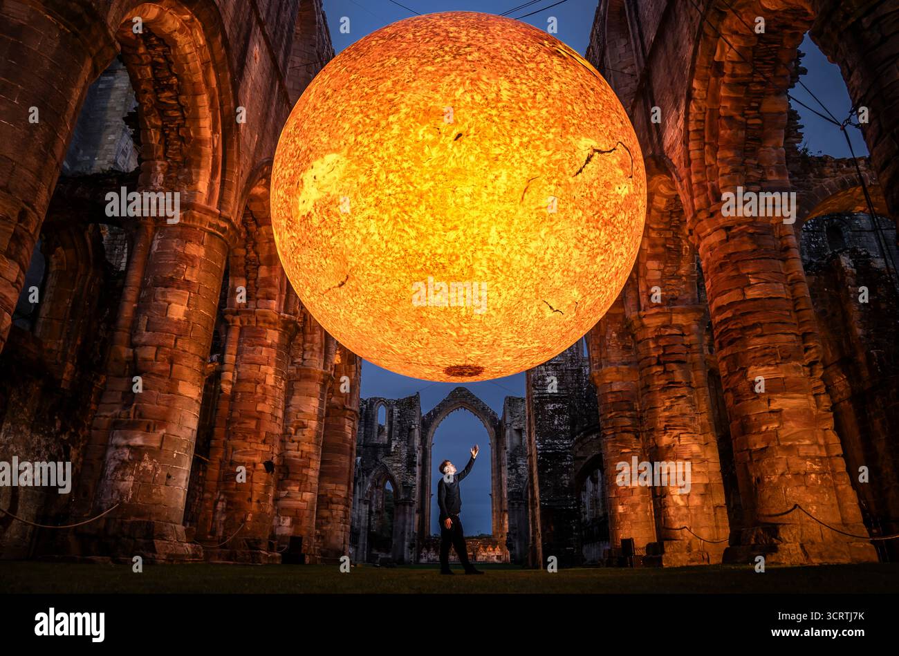 Artist Luke Jerram, with is work Helios, a seven-metre sun sculpture and soundscape, suspended ...