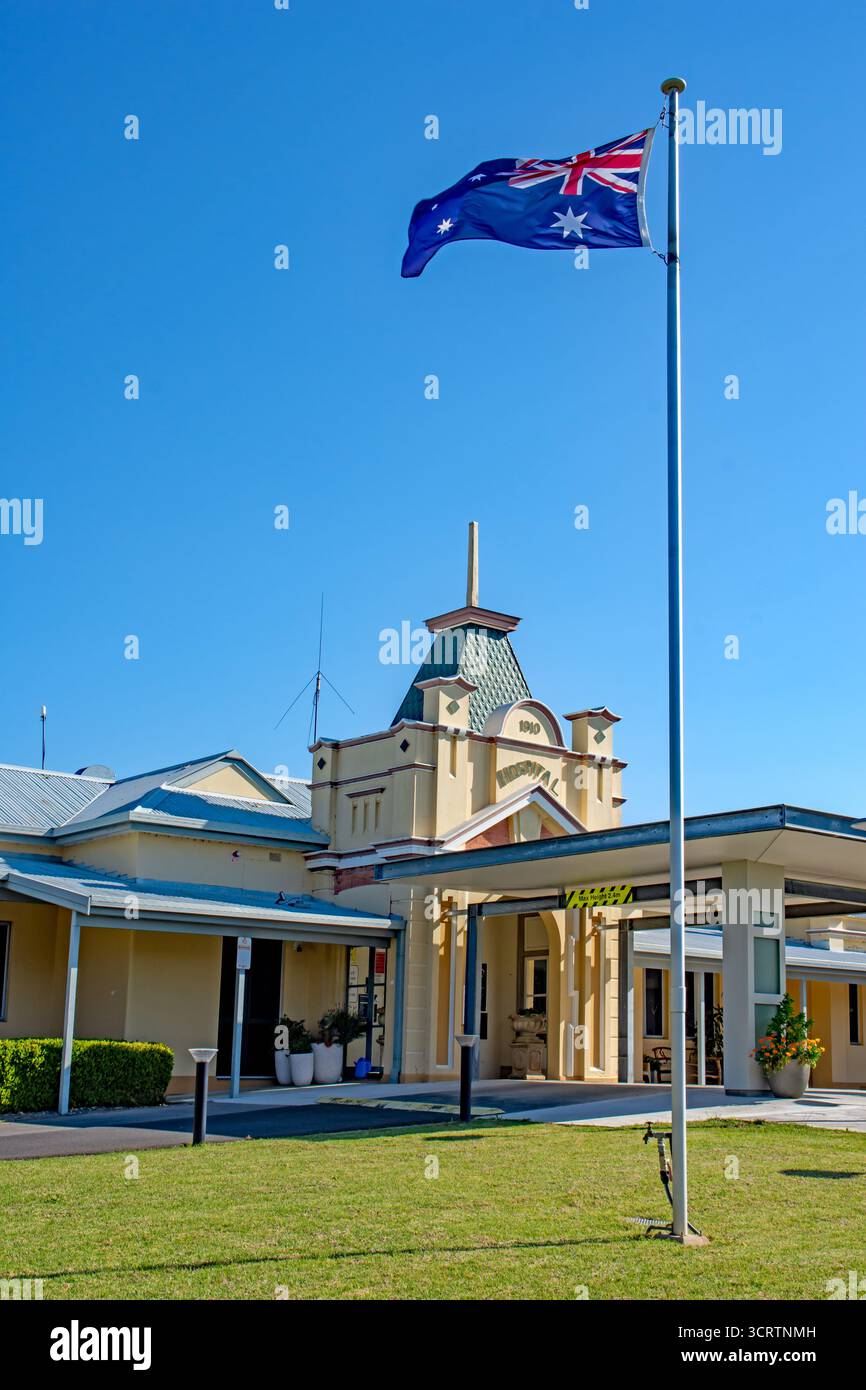 Australian flag flying in front of a country town Edwardian hospital ...