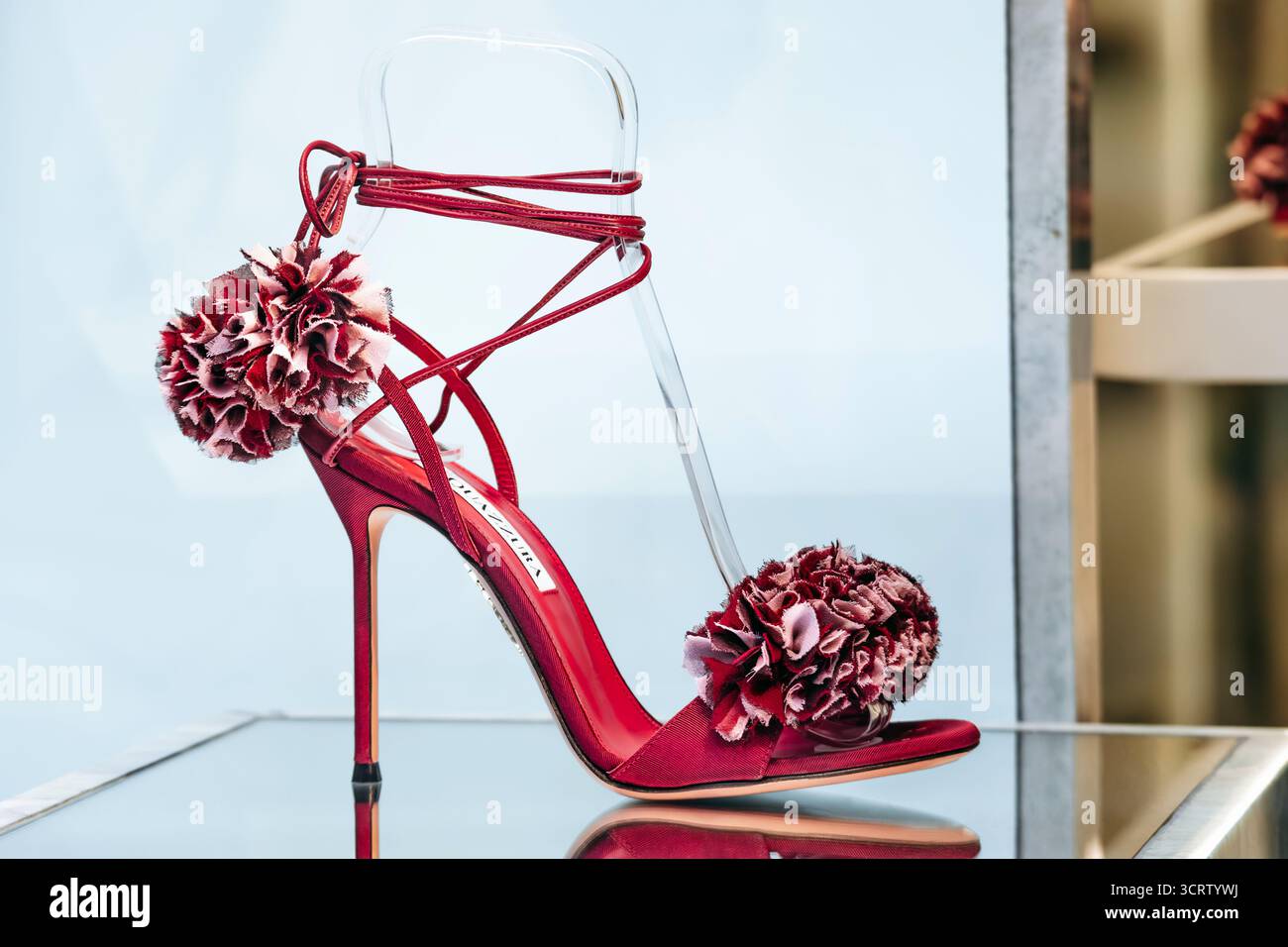 Paris, France - September 7, 2025: Aquazzura red high heel shoe with ...