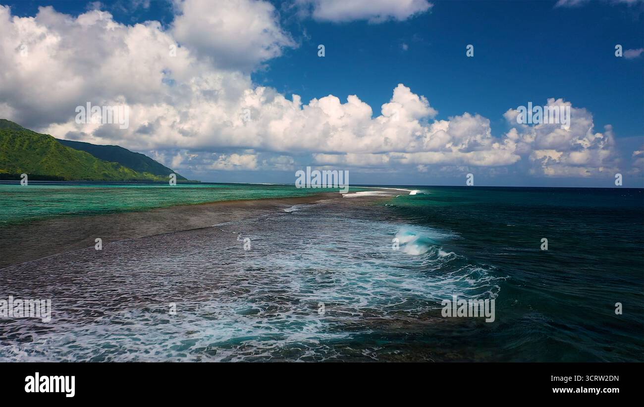 Aerial view of the reef's edge where turquoise shallows meet the deep ...