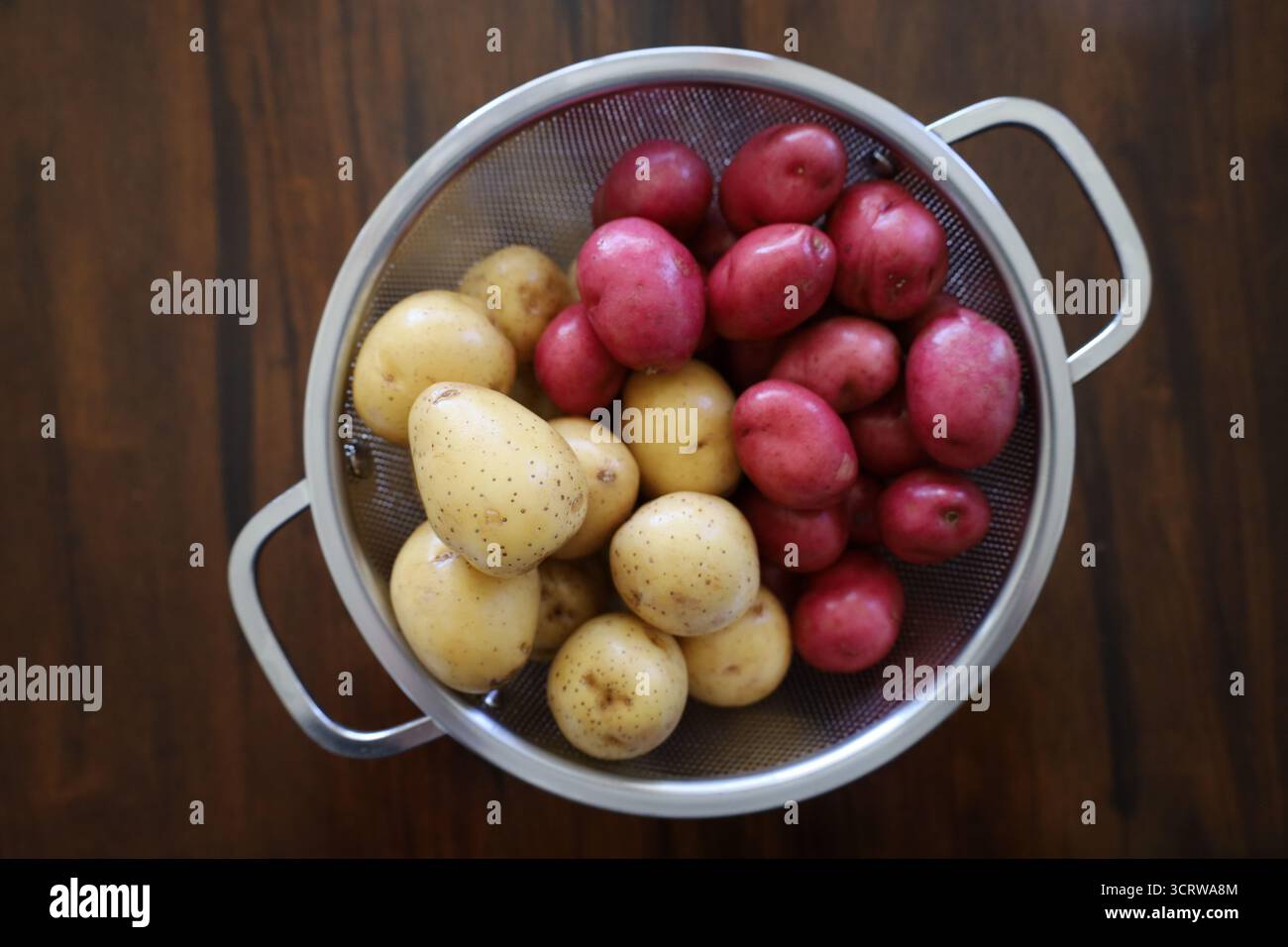 Fresh Red and Yellow Potatoes in Colander Stock Photo - Alamy