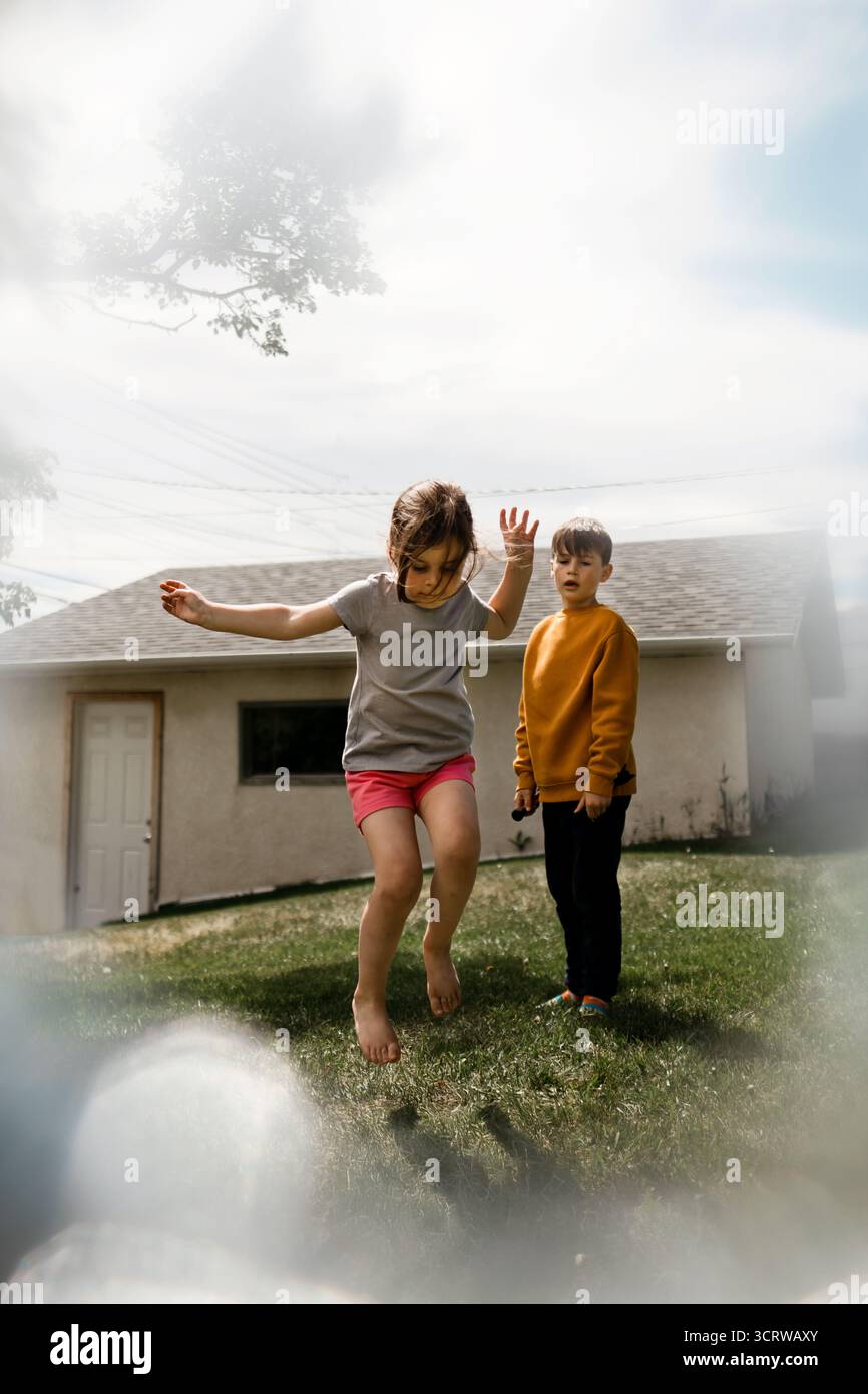Girl jumping boy watches hi-res stock photography and images - Alamy