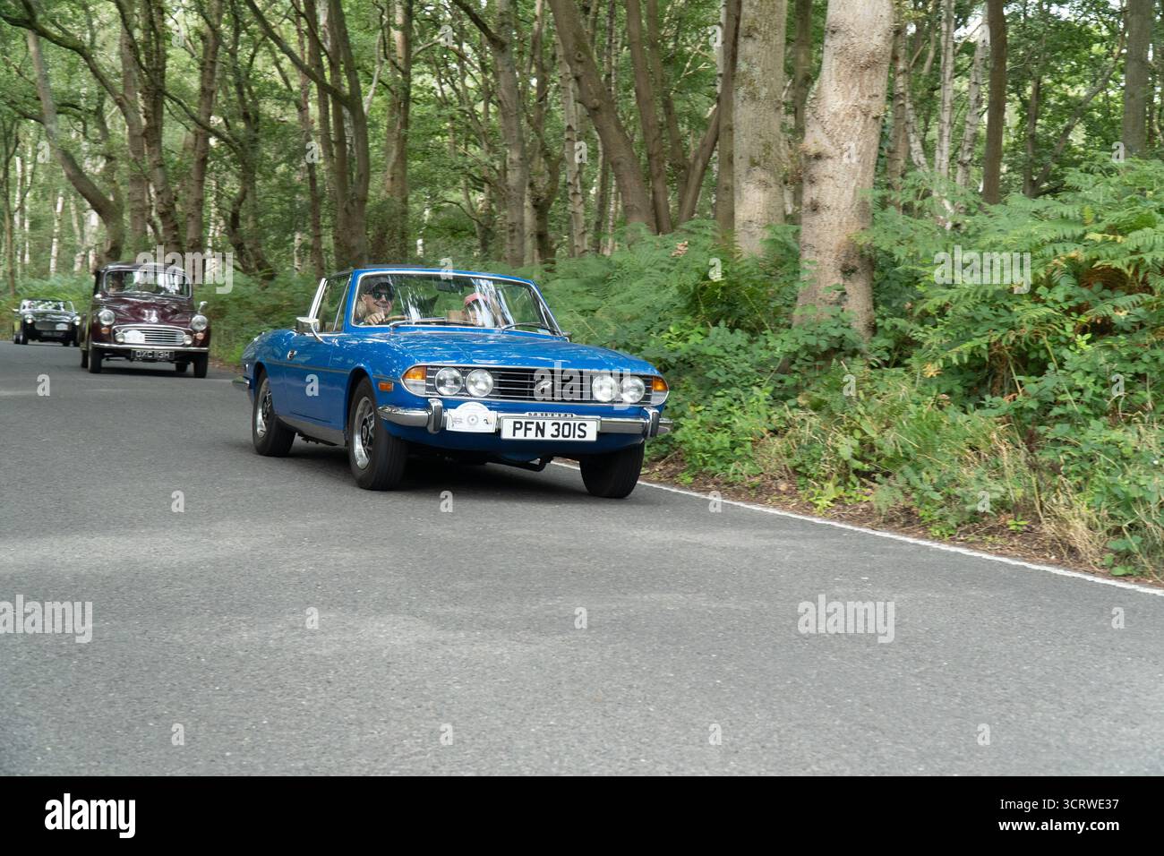 Triumph Stag sports car convertible Classic Car driving in country lane ...