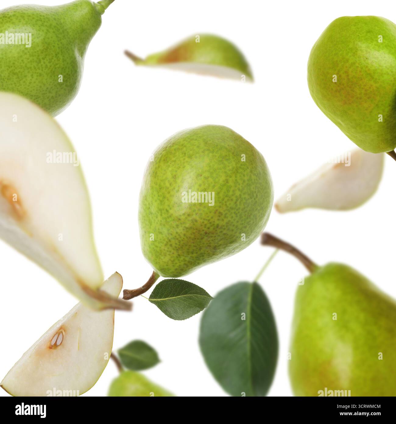Fresh green pears flying in air on white background Stock Photo - Alamy