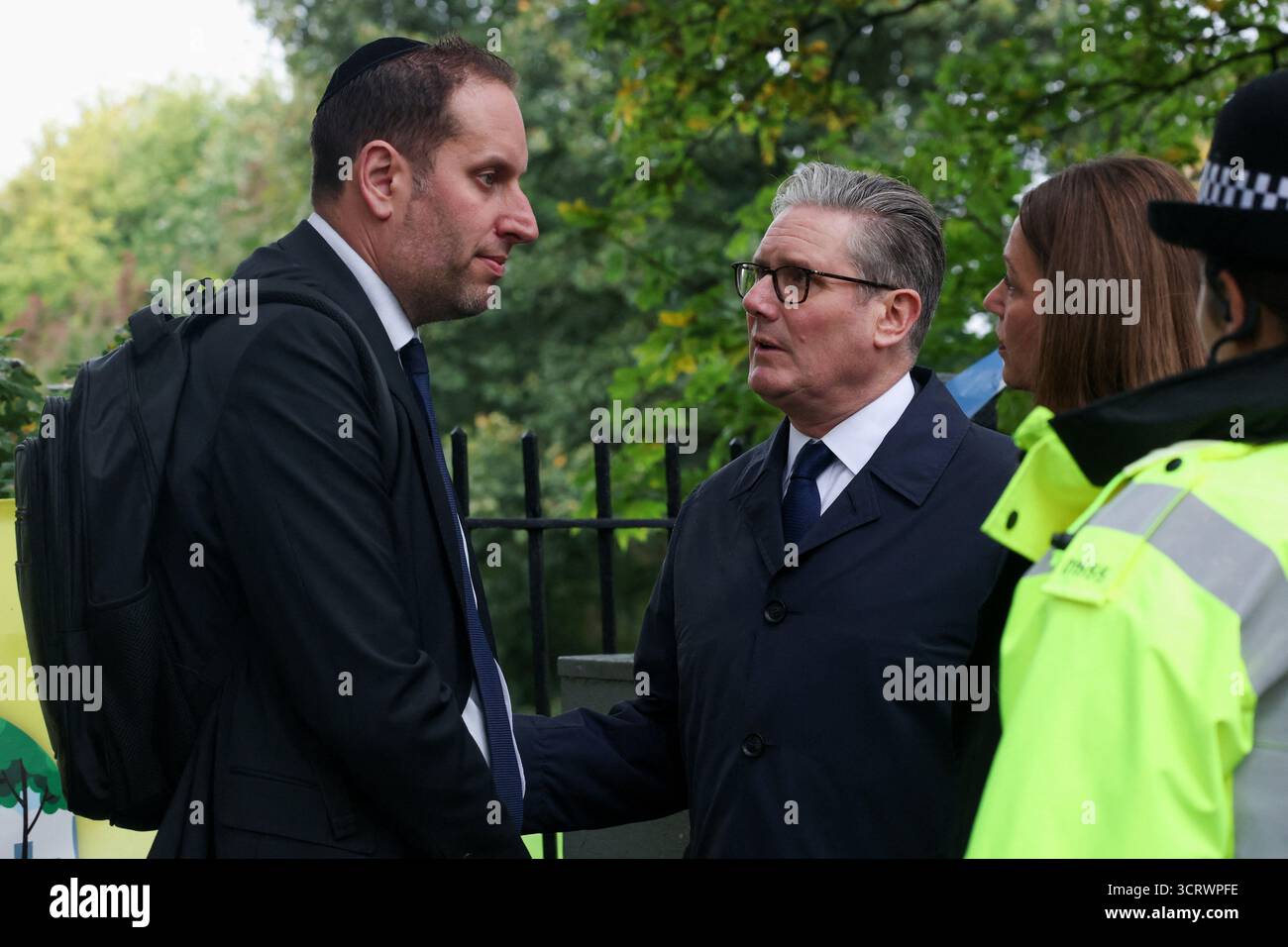Britain's Prime Minister Keir Starmer speaks to a member of the Jewish ...