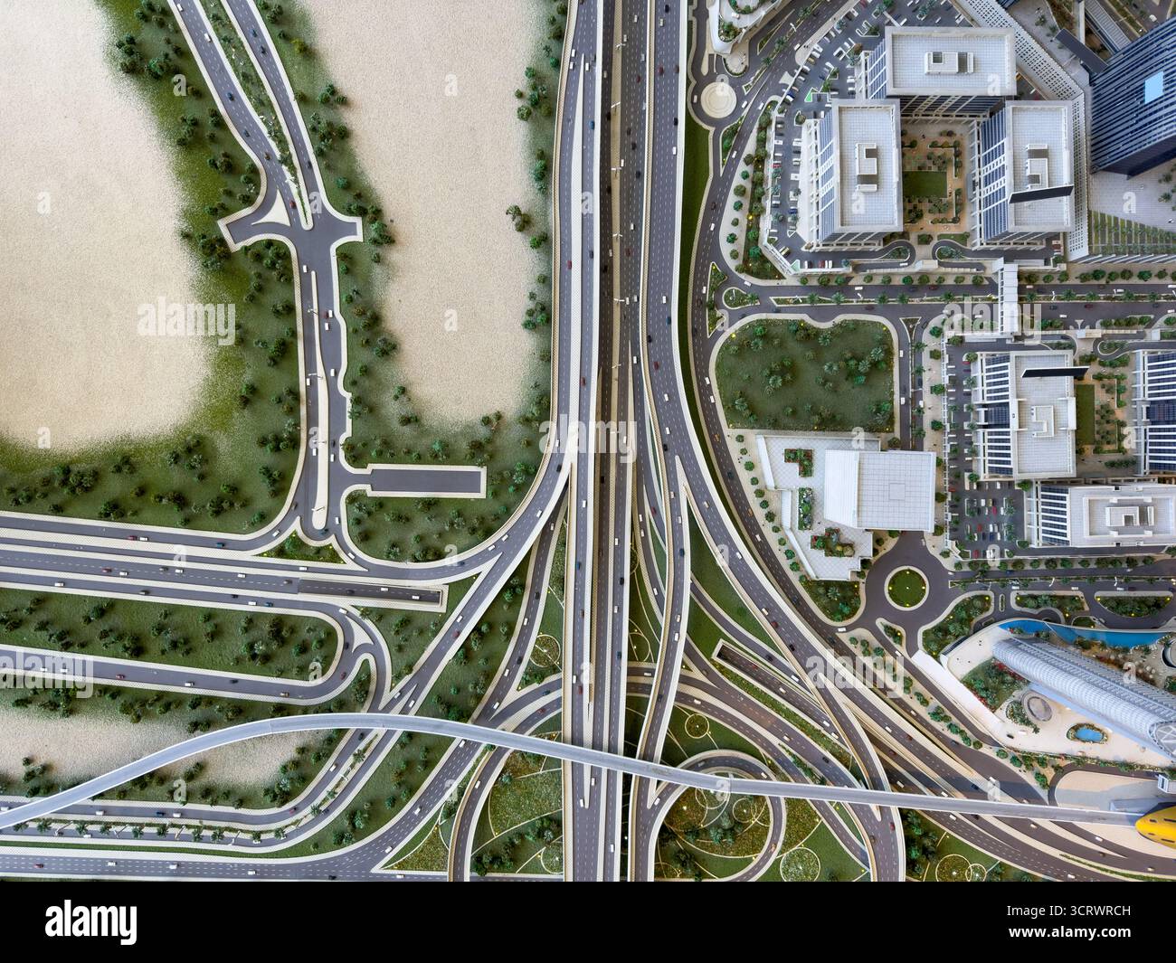 Aerial view of modern highway interchange with green landscaping and ...