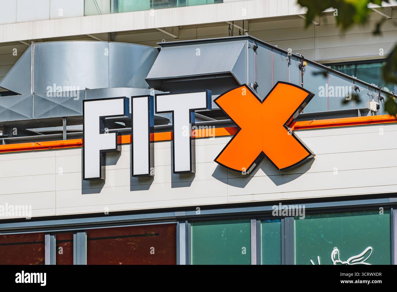 FitX German fitness company's logo on the top of an entrance to the gym ...