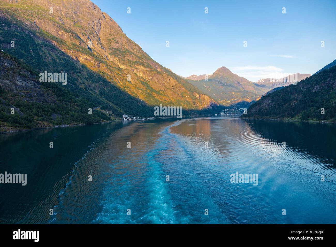 Sunset in the iconic UNESCO-protected Geiranger fjord in Norway with ...