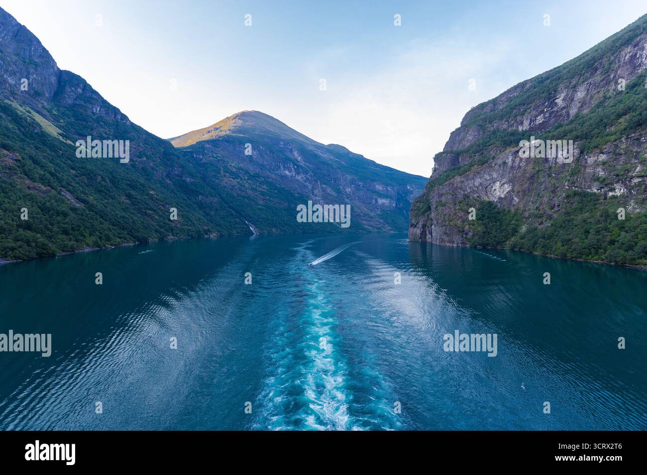 Sunset in the iconic UNESCO-protected Geiranger fjord in Norway with ...