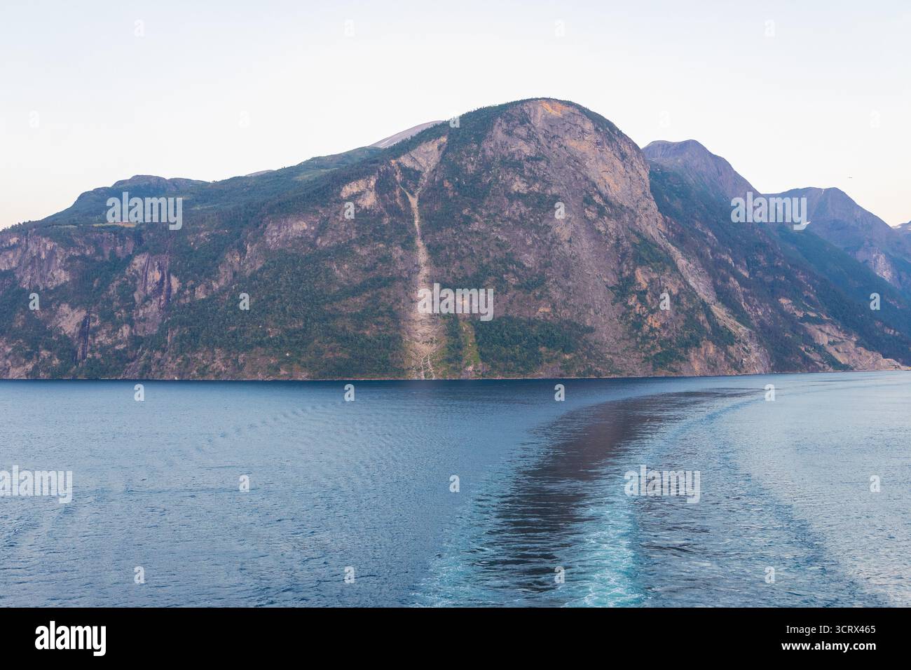 Sunset in the iconic UNESCO-protected Geiranger fjord in Norway with ...