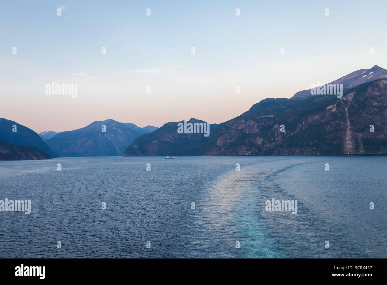 Sunset in the iconic UNESCO-protected Geiranger fjord in Norway with ...