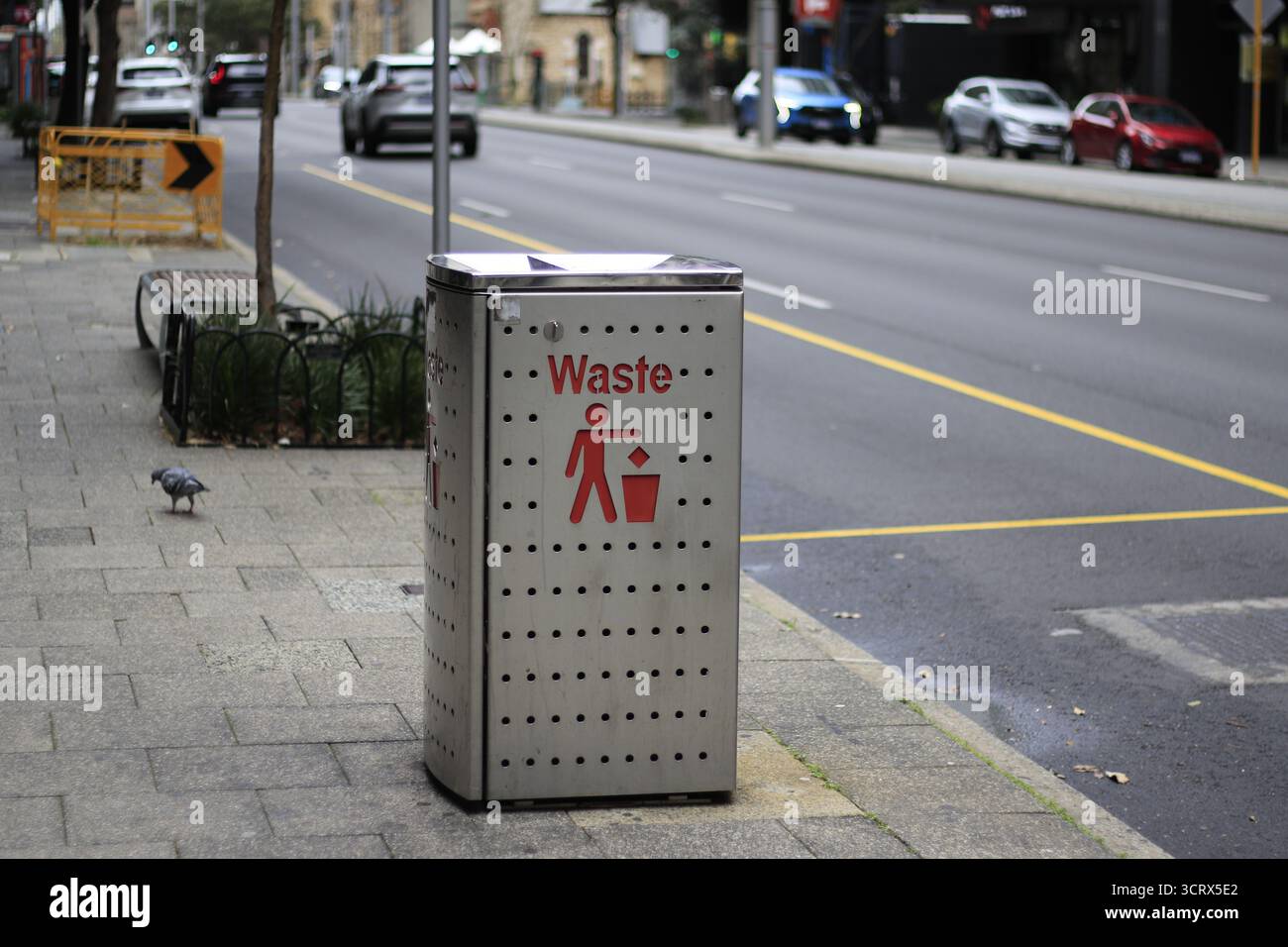 A modern waste bin on a street in Perth, Western Australia Stock Photo ...