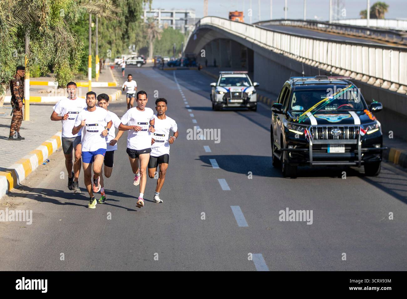 Athletes run during a marathon to celebrate Iraqi Independence Day in ...