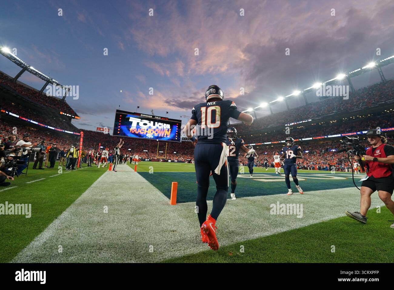 Denver Broncos quarterback Bo Nix (10) scores a touchdown against the ...