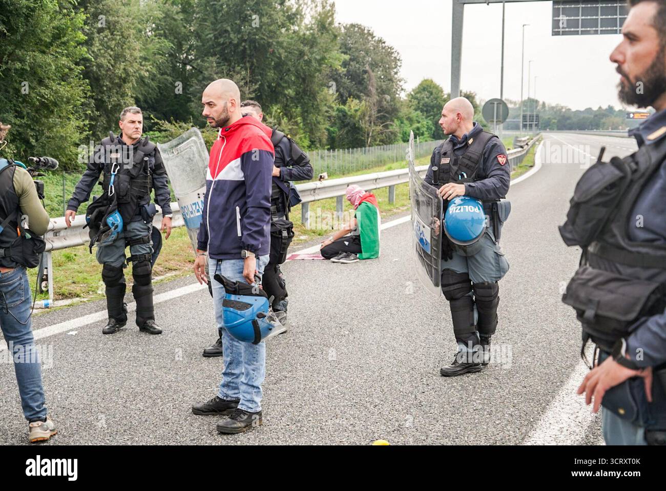 Milan, a boy praying on the ring road, following the strike demonstration after the arrest of ...