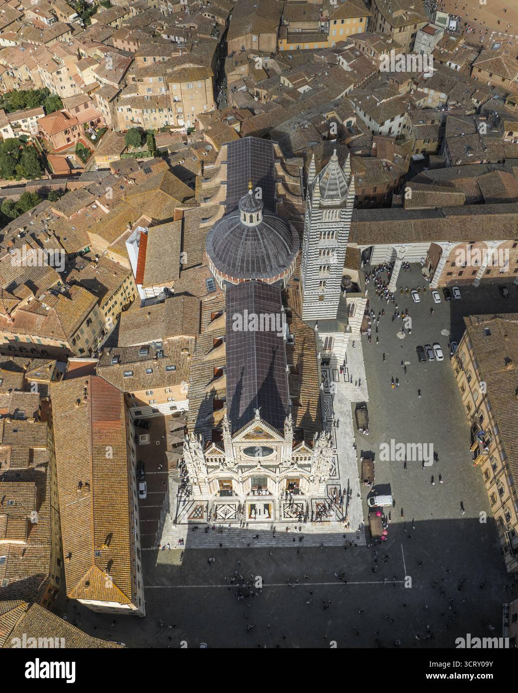 Aerial view of the Duomo di Siena's grand dome and Torre del Mangia ...