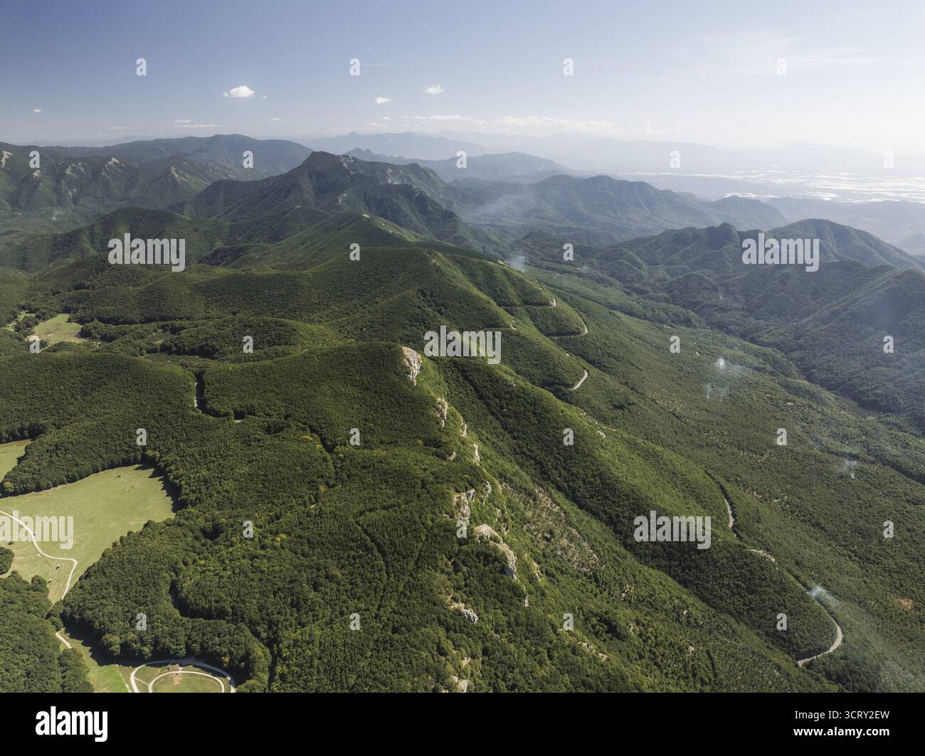 Aerial view of rugged peaks and verdant slopes create a stunning ...