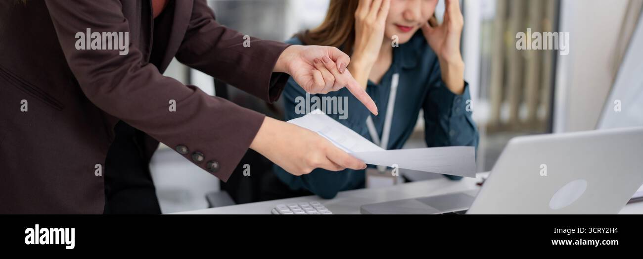 Asian businesswomen collaborate problem solving analyzing documents ...