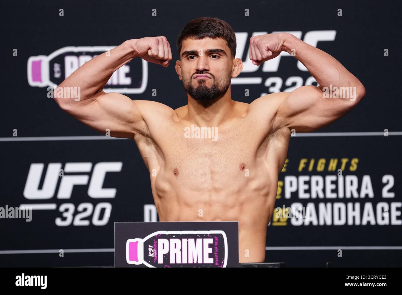 LAS VEGAS, NV - OCT 3:Ramiz Brahimaj steps on the scale for the ...