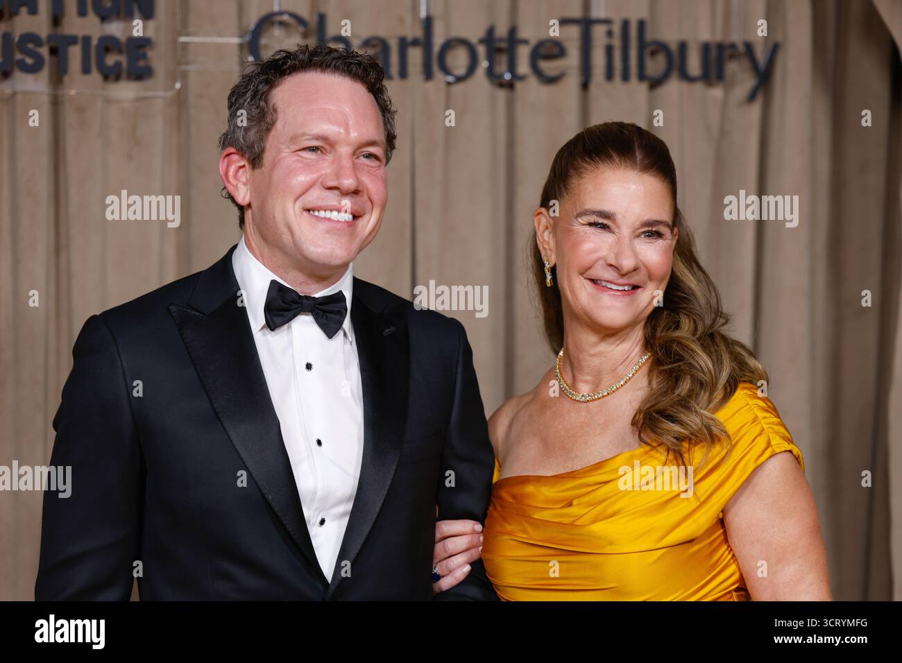 Philip Vaughn, left, and Melinda French Gates pose for photographers ...