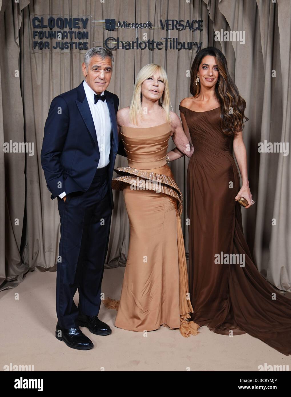 George Clooney, Donatella Versace and Amal Clooney arrive at the Albie Awards, at the Natural ...