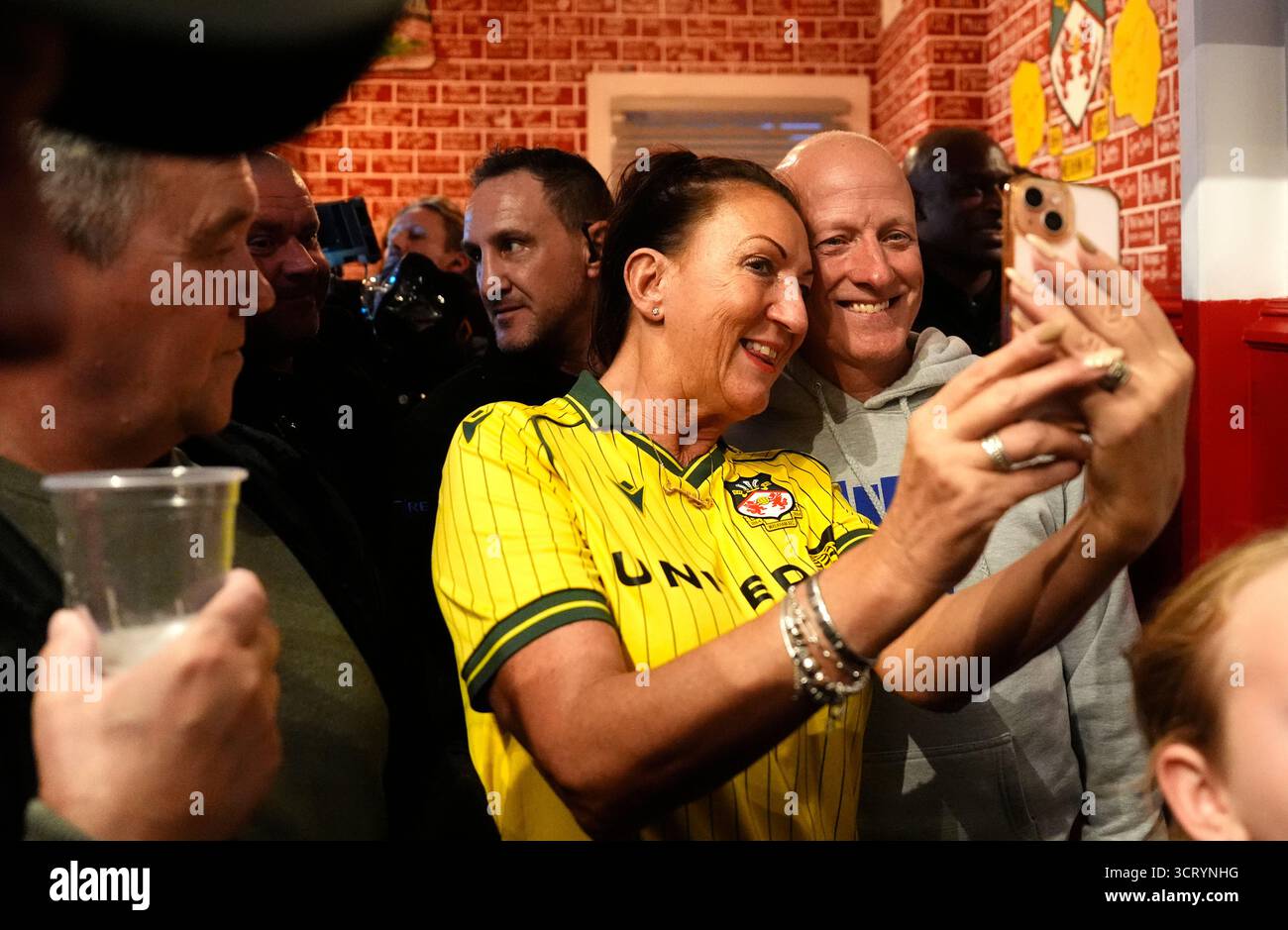 Birmingham City co-owner and chairman Tom Wagner (right) takes photos ...