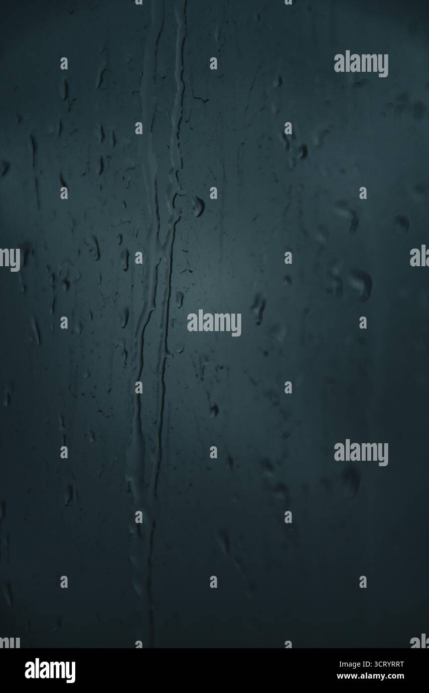 Moody Rain Streaks on Dark Window Glass during a Storm Stock Photo - Alamy