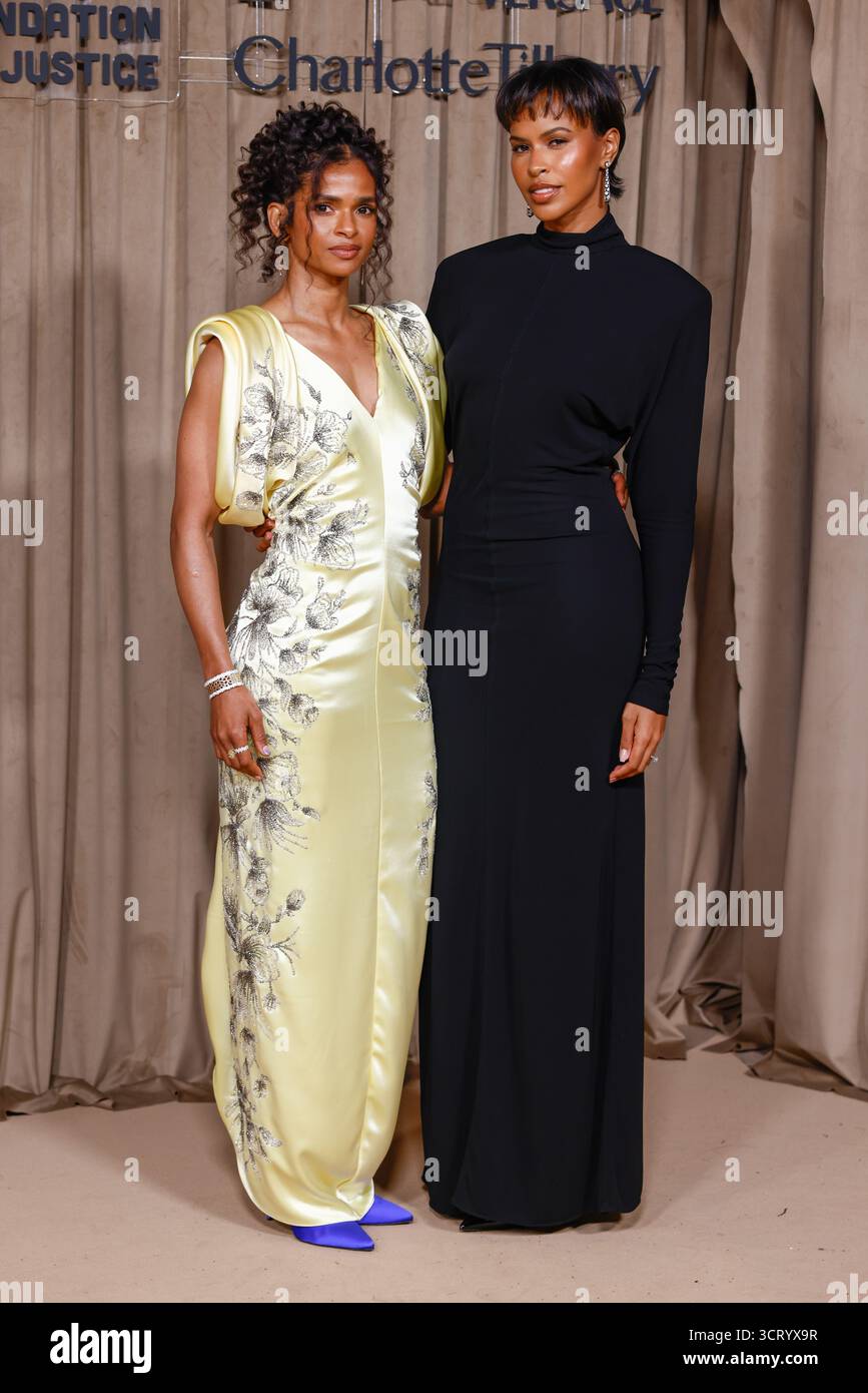 Ramla Ali, left, and Sabrina Dhowre Elba pose for photographers upon ...