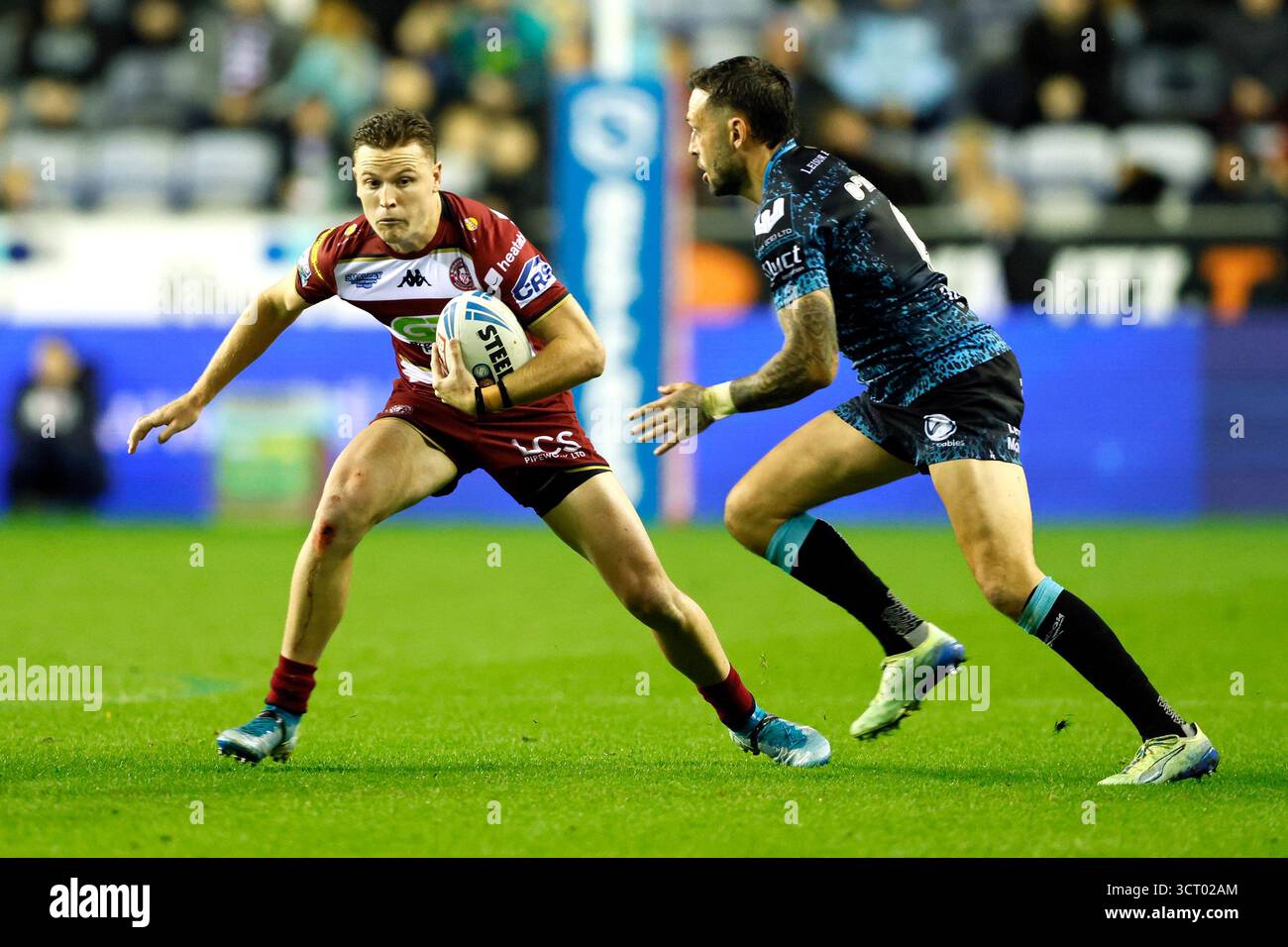 Wigan Warriors' Jai Field (left) in action during the Betfred Super ...