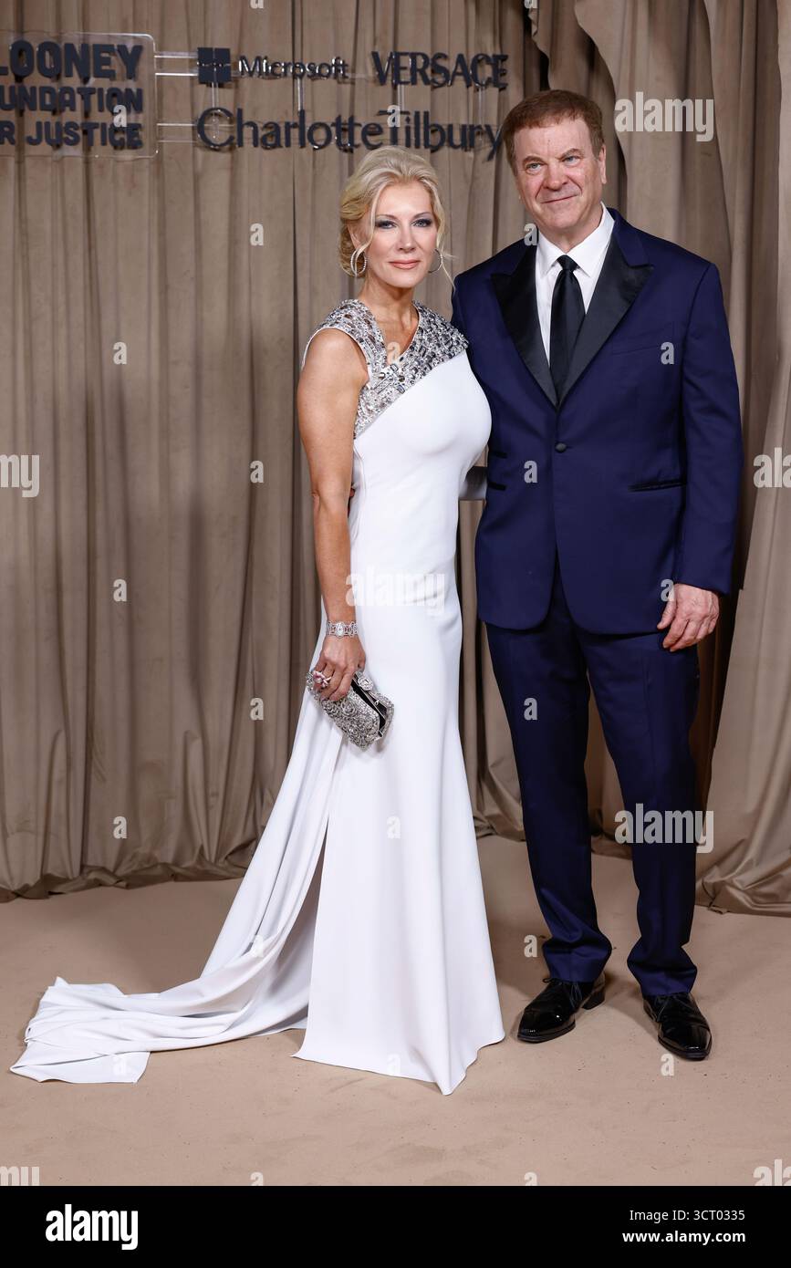 Kari Wagner, left, and Todd Wagner pose for photographers upon arrival ...