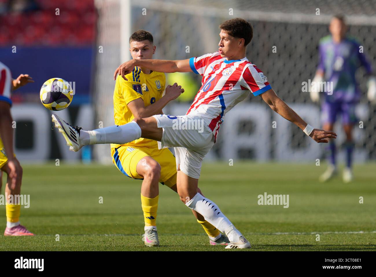 Paraguay's Octavio Alfonso, front, controls the ball past Ukraine's ...