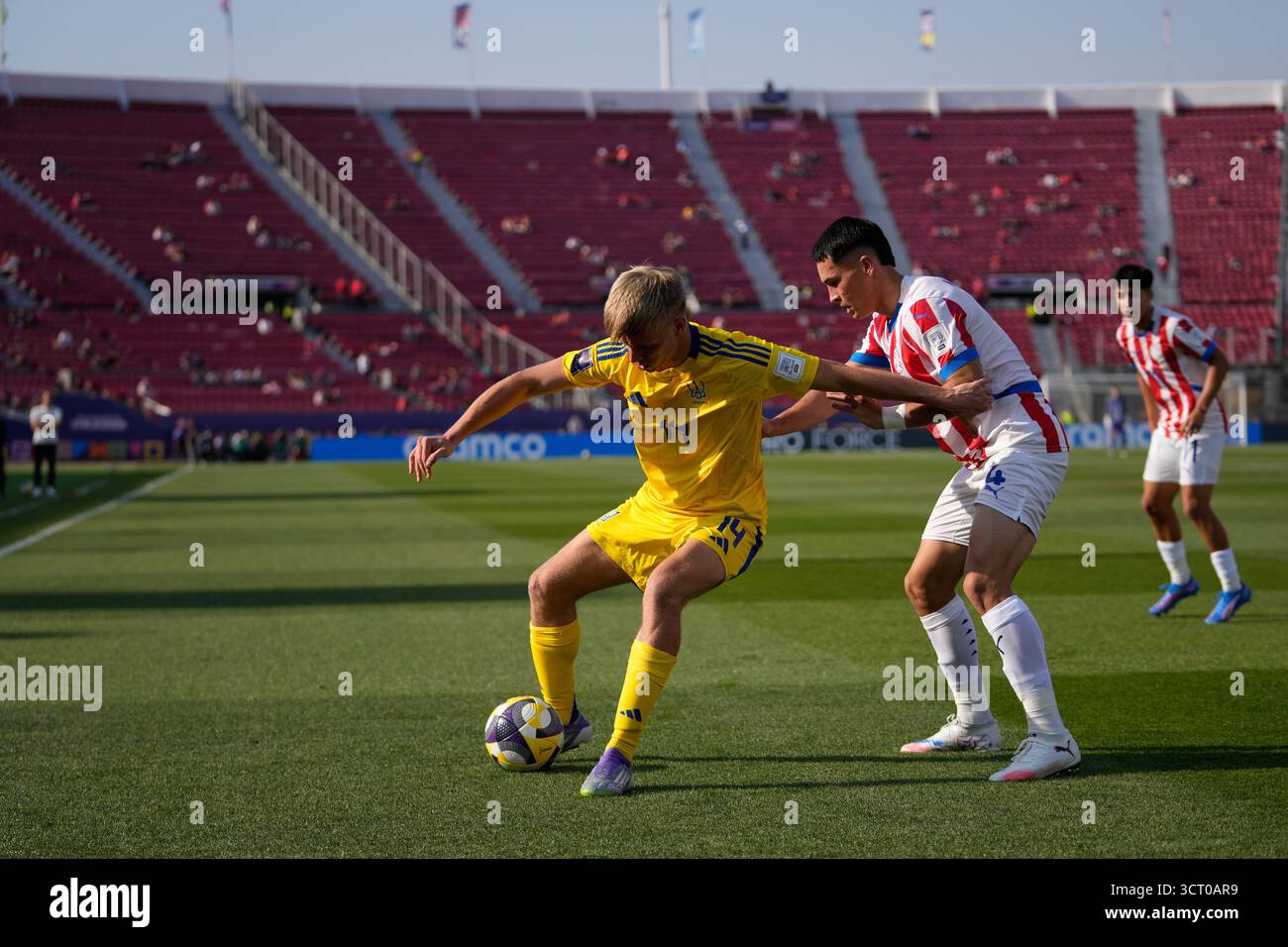 Paraguay's Alexandro Maidana, left, challenges Ukraine's Kristian ...