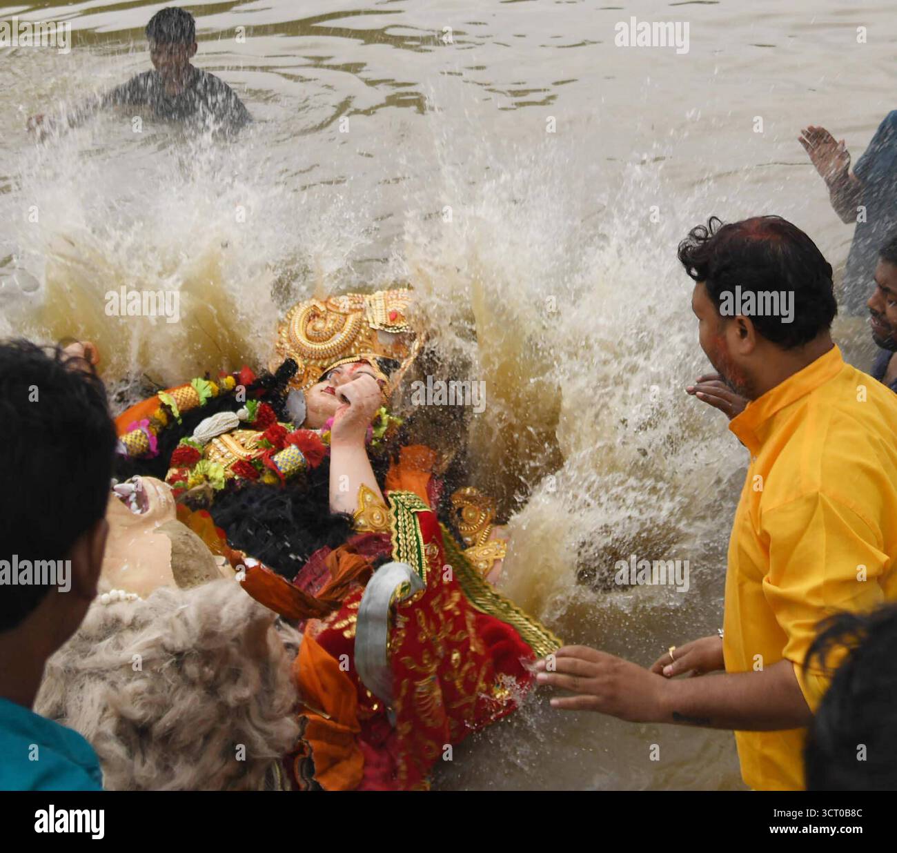 PATNA, INDIA - OCTOBER 3: Devotees immersing idol of Goddess Durga in ...