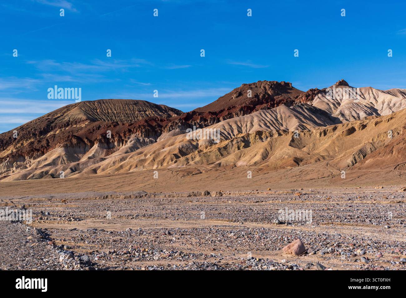 Striped desert hills and glowing mountains in Death Valley National ...