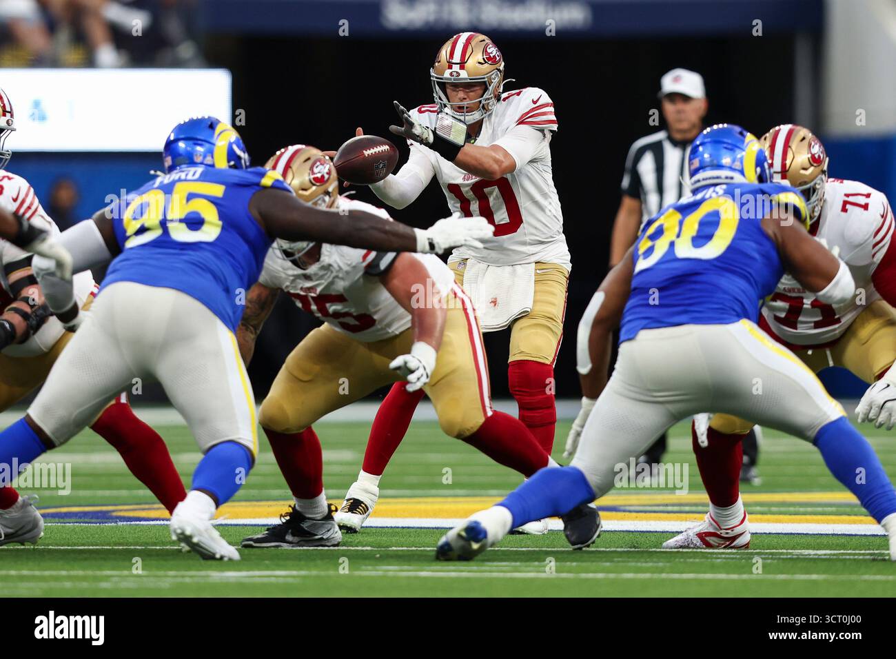 San Francisco 49ers quarterback Mac Jones (10) receives the snap during ...