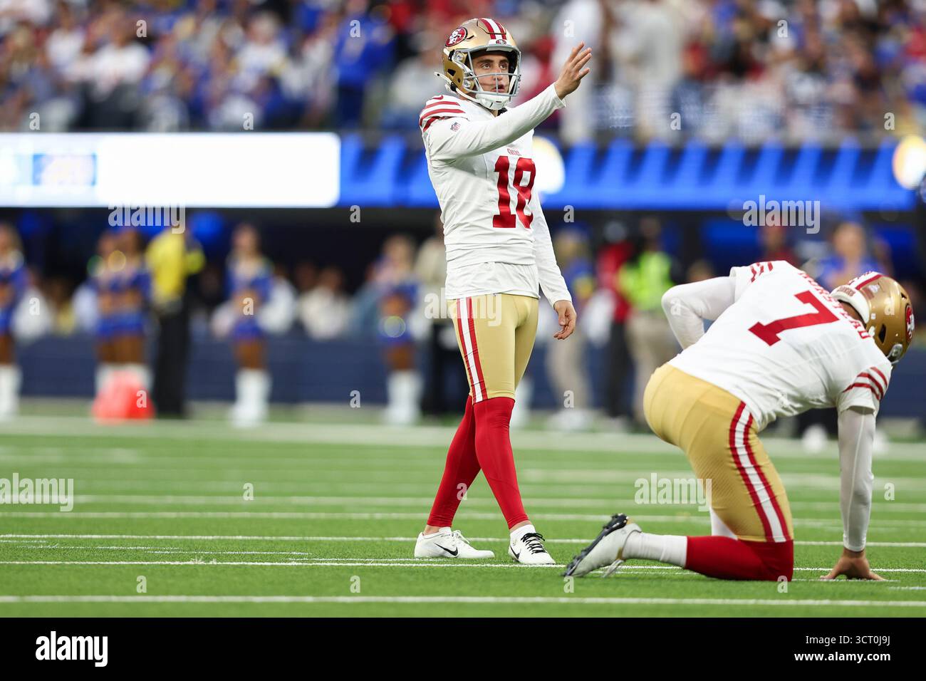 San Francisco 49ers kicker Eddy Piñeiro prepares for a kick as punter Thomas Morstead (7 ...