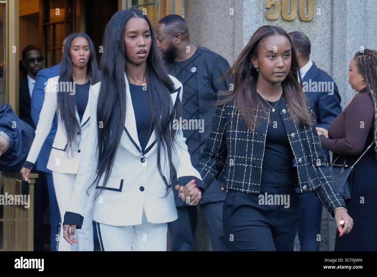 The twin daughters of Sean "Diddy" Combs, Chance Combs, right, and D'Lila Star Combs, leave ...