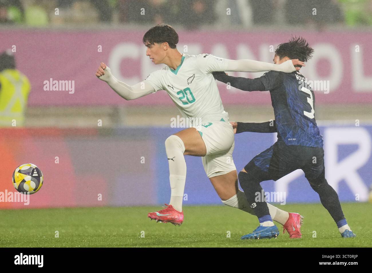 New Zealand's Stipe Ukich, left, is challenged by Japan's Keita Kosugi ...