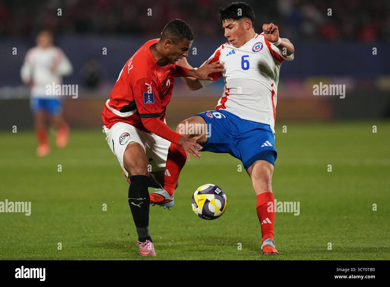 Egypt's Moaataz Mohamed, left, and Chile's Javier Carcamo vie for the ...