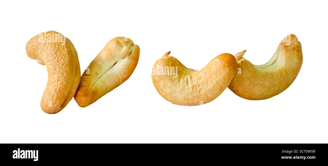 A set of four roasted or baked cashew nuts in two heaps is isolated on ...