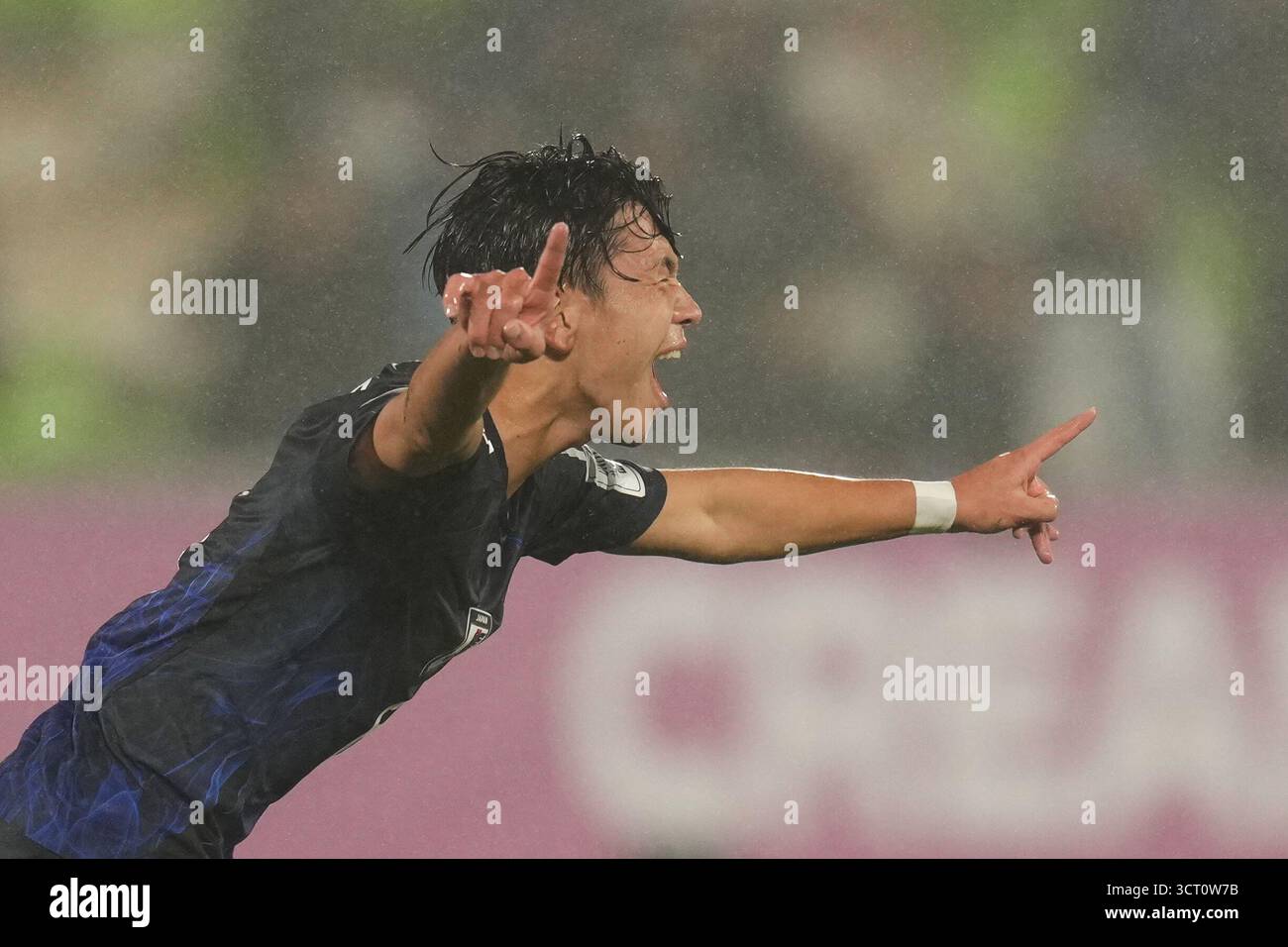 Japan's Kosei Ogura celebrates scoring his side's opening goal against ...