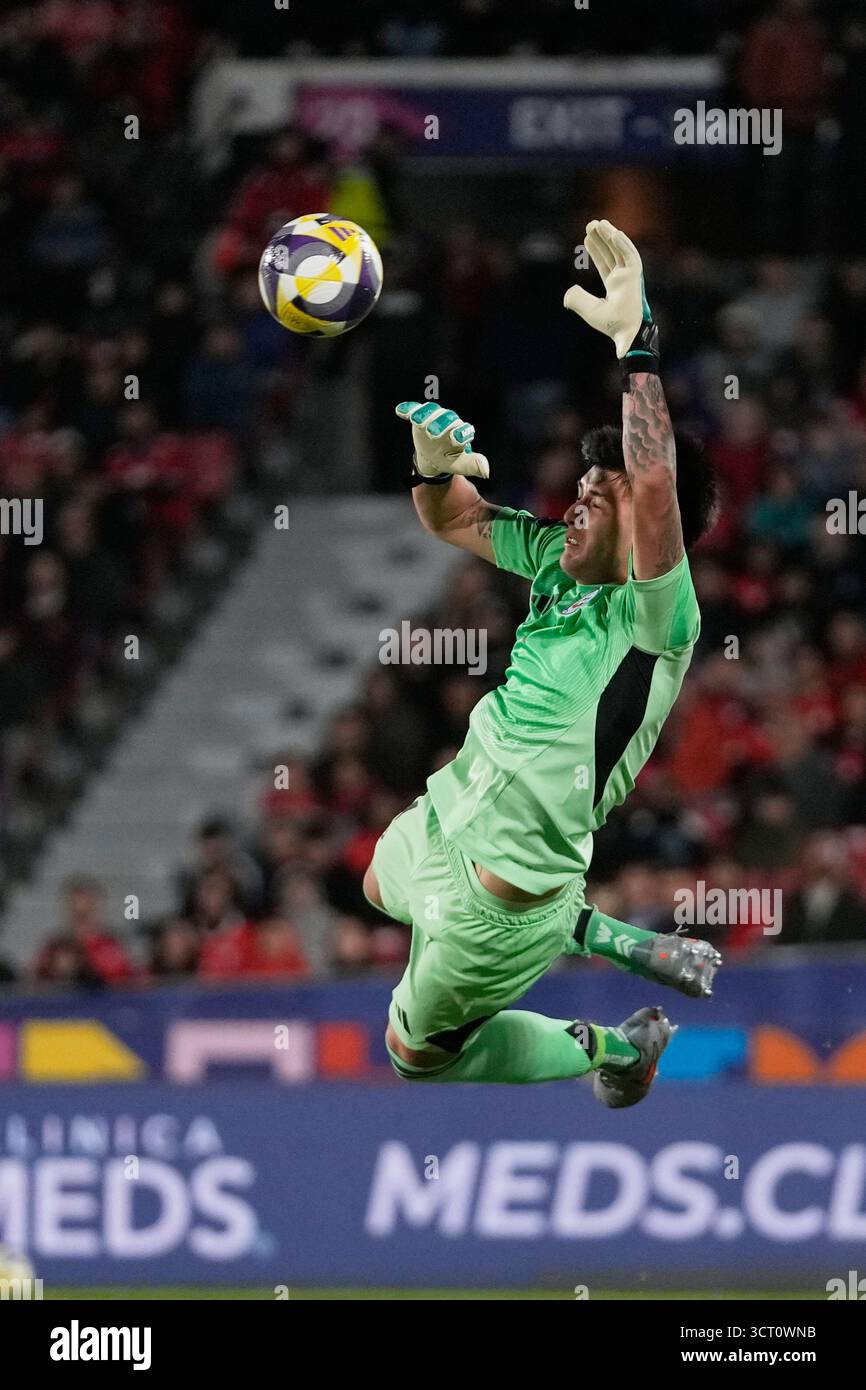 Chile's goalkeeper Sebastian Mella dives for the ball during a FIFA U ...