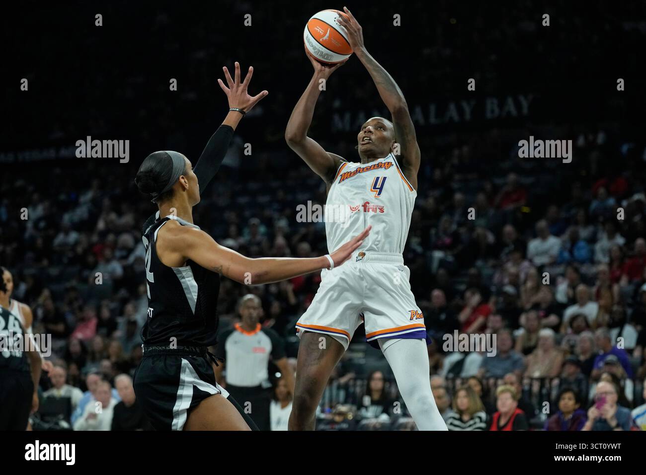 Phoenix Mercury forward Natasha Mack (4) shoots over Las Vegas Aces ...