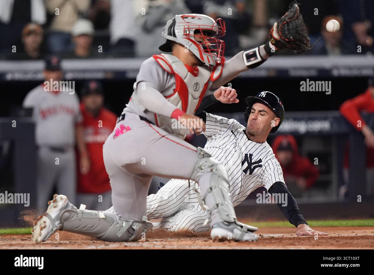New York Yankees' Cody Bellinger slides safely into home plate to score ...