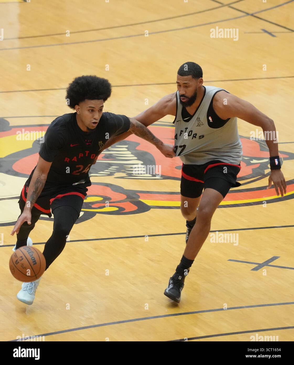 Toronto Raptors' Chucky Hepburn, left, gets past Garrett Temple during ...