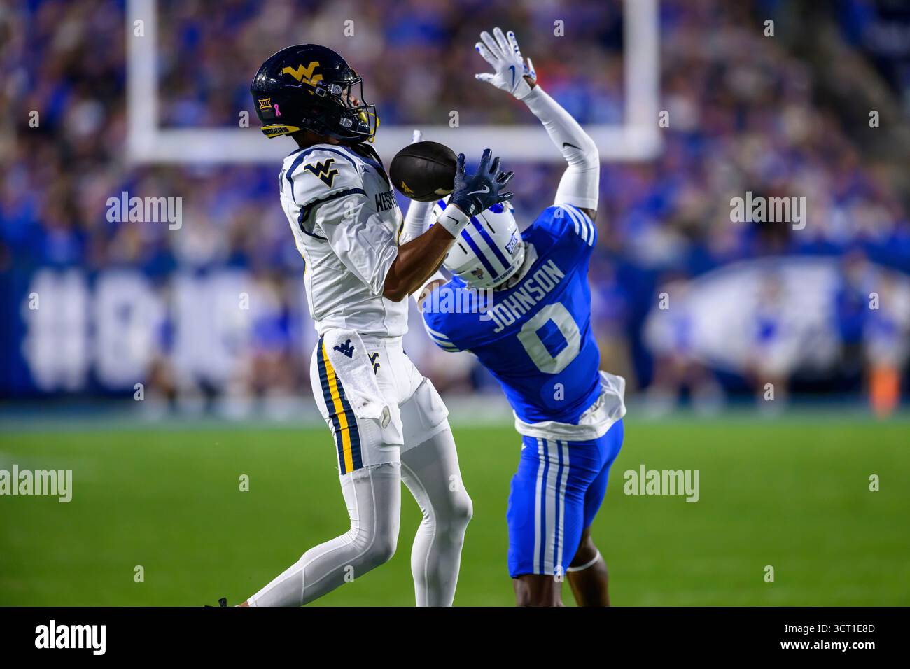 West Virginia wide receiver Cam Vaughn (4) fights to make the catch ...