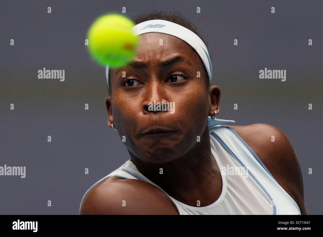 Coco Gauff of the United States returns a shot from compatriot Amanda ...