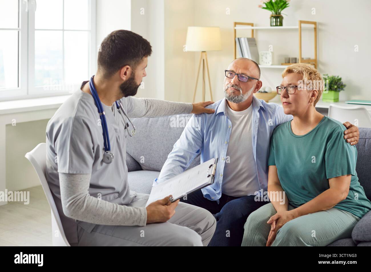 Compassionate nurse and couple hi-res stock photography and images - Alamy