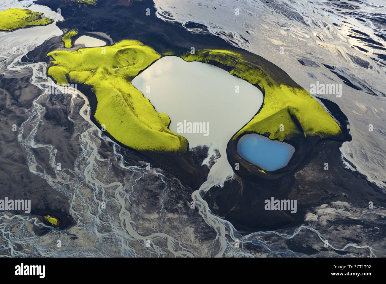 Turquoise-coloured crater lake with moss-covered crater rims in the ...