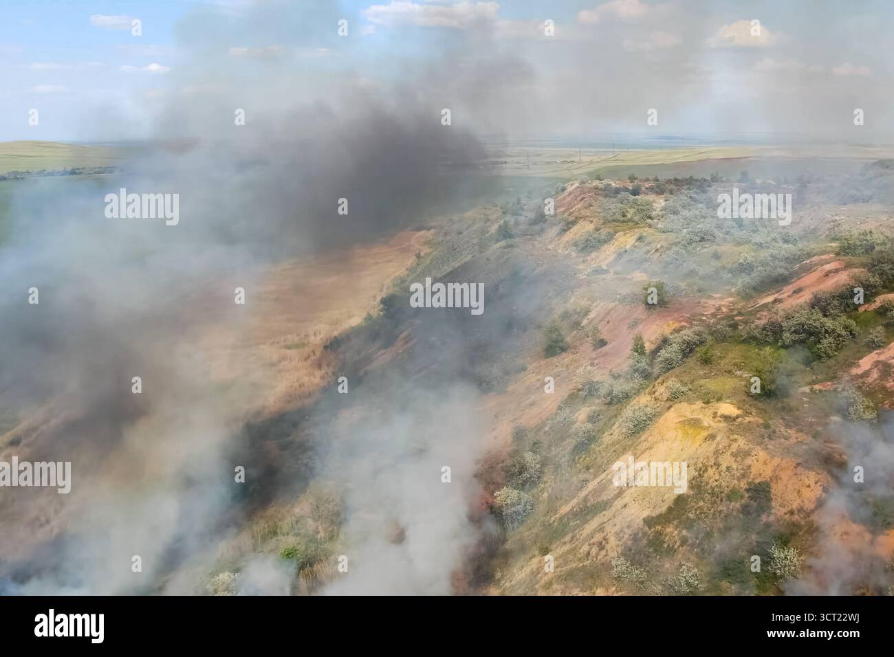 Steppe fire. Burning dry grass, fire and smoke Stock Photo - Alamy